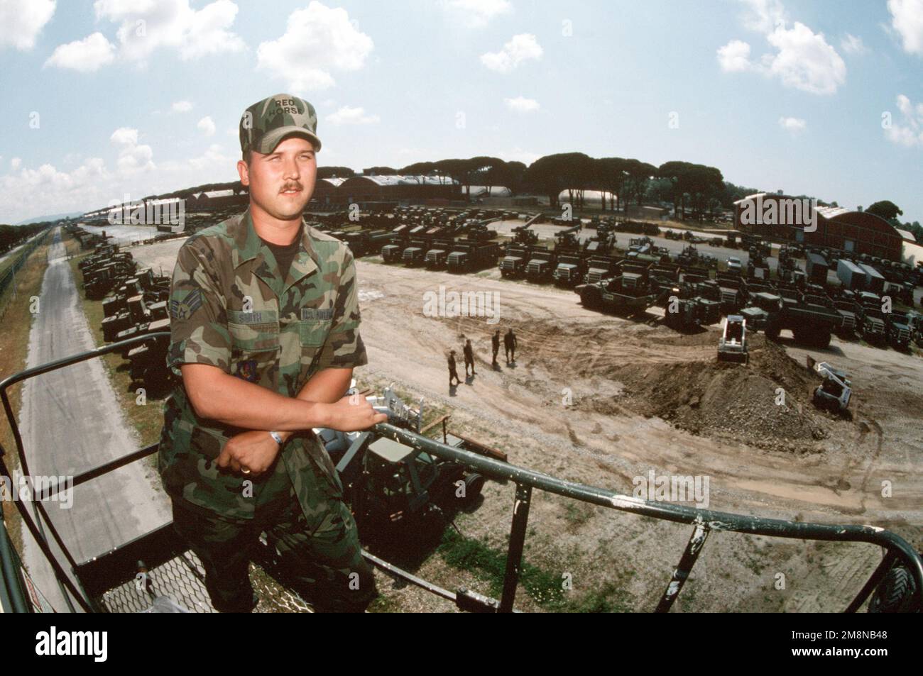 Straight on medium shot of USAF SENIOR AIRMAN Dan Smith as he stands ...
