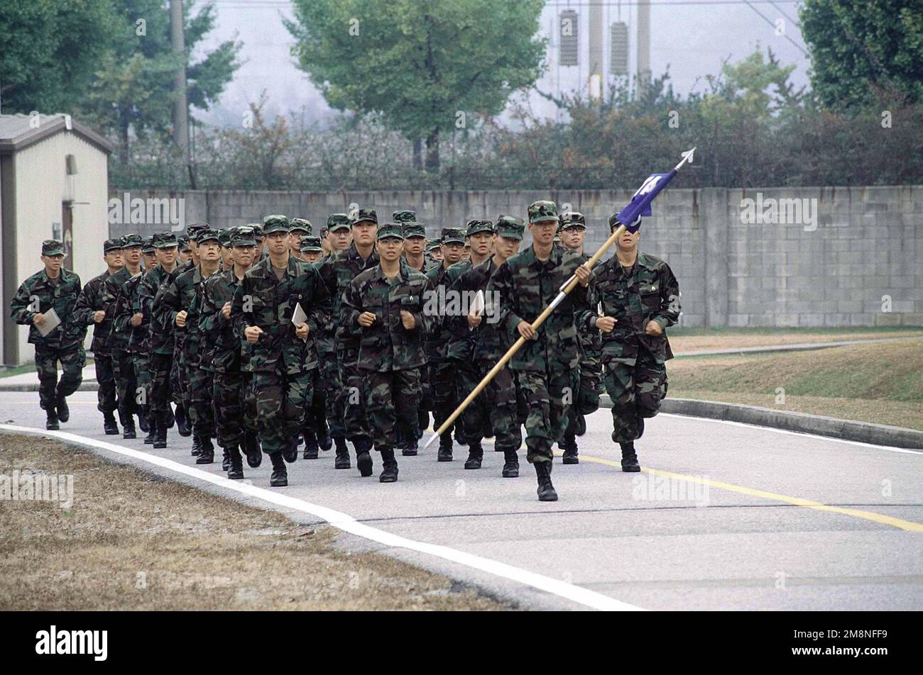 A platoon of Korean Augmentees to the US Army (KATUSA), march to the ...
