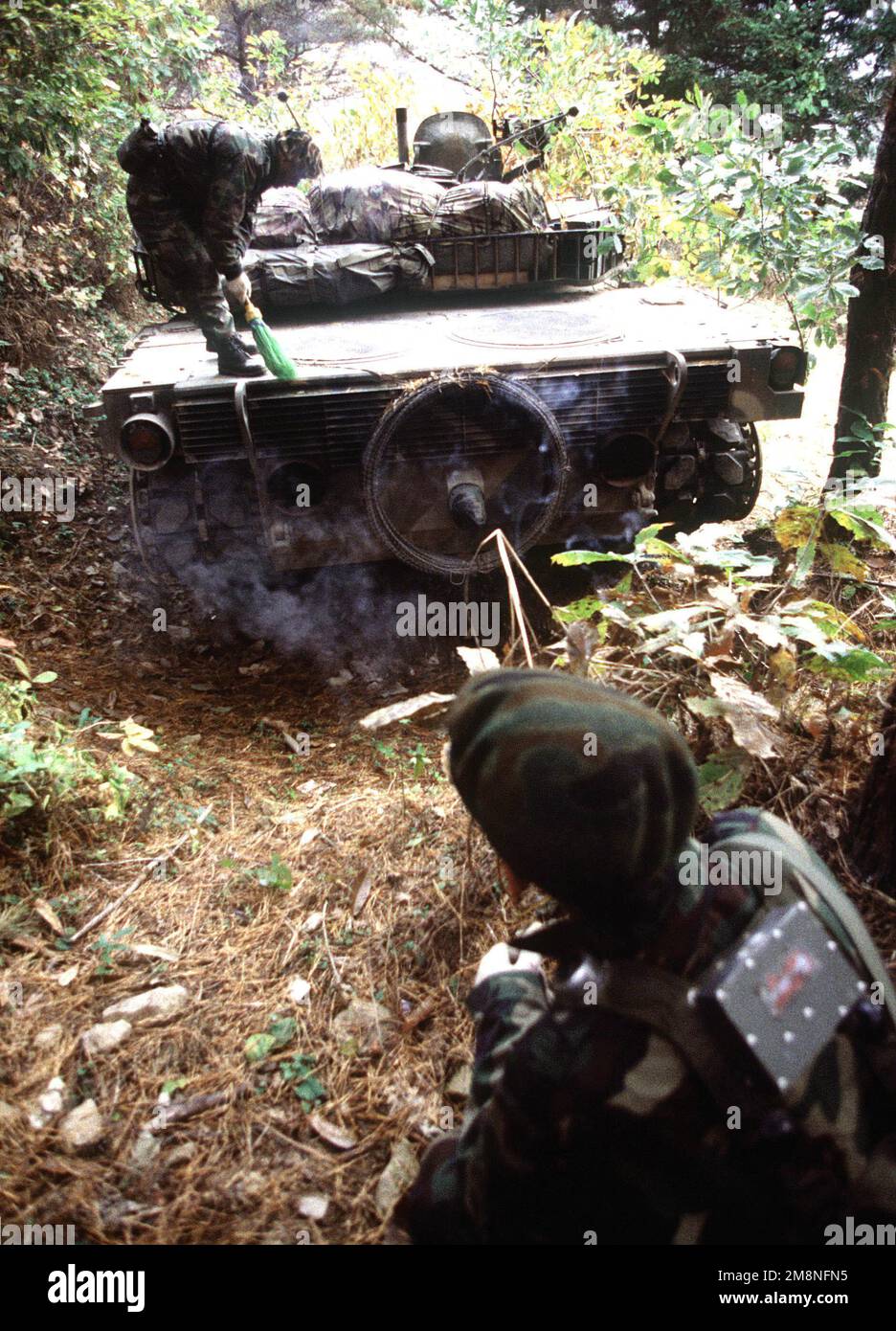 A Republic of Korea Army (ROKA) soldier takes a smoke break while ...