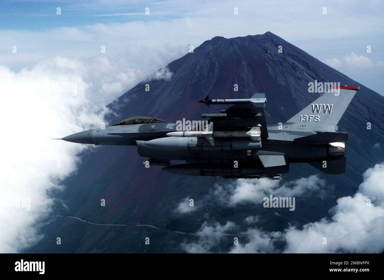 Left side profile medium aerial shot of a USAF F-16C from the 13th ...