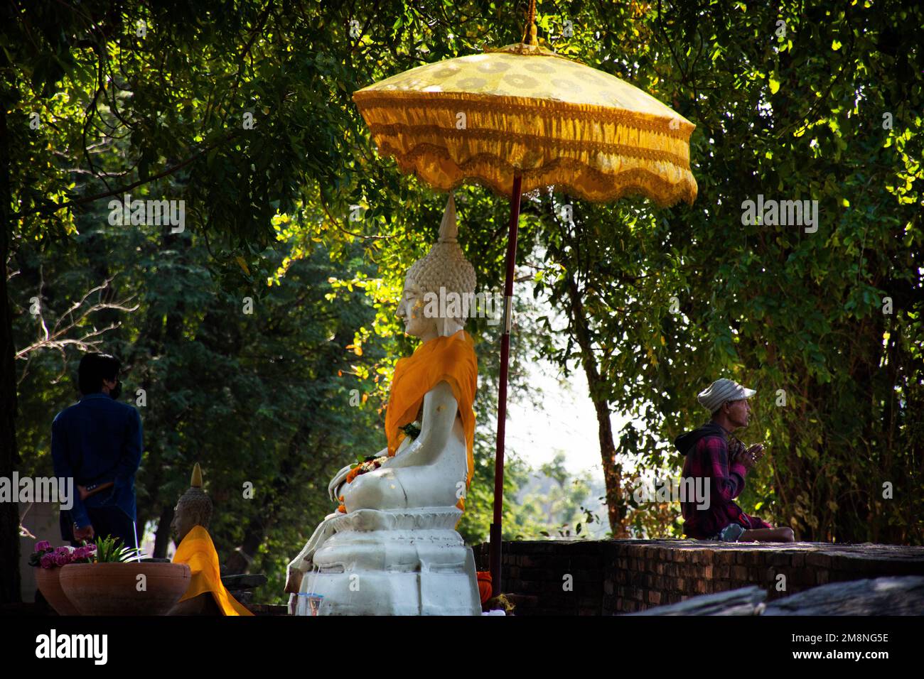 Ancient antique buddha statue and ruins old chedi stupa for thai people ...