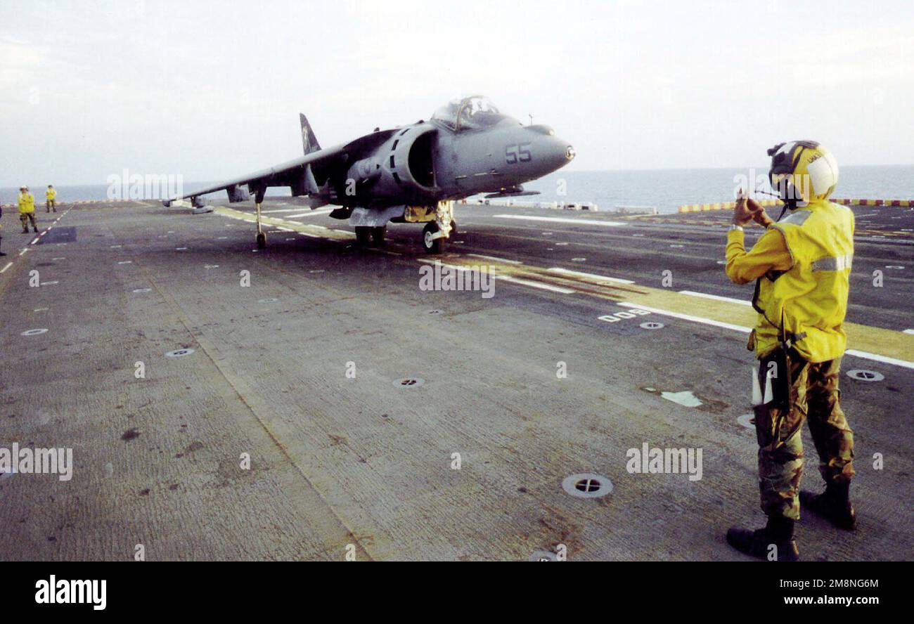 A Navy Yellow Jacket signals the visual condition of the aircraft he ...