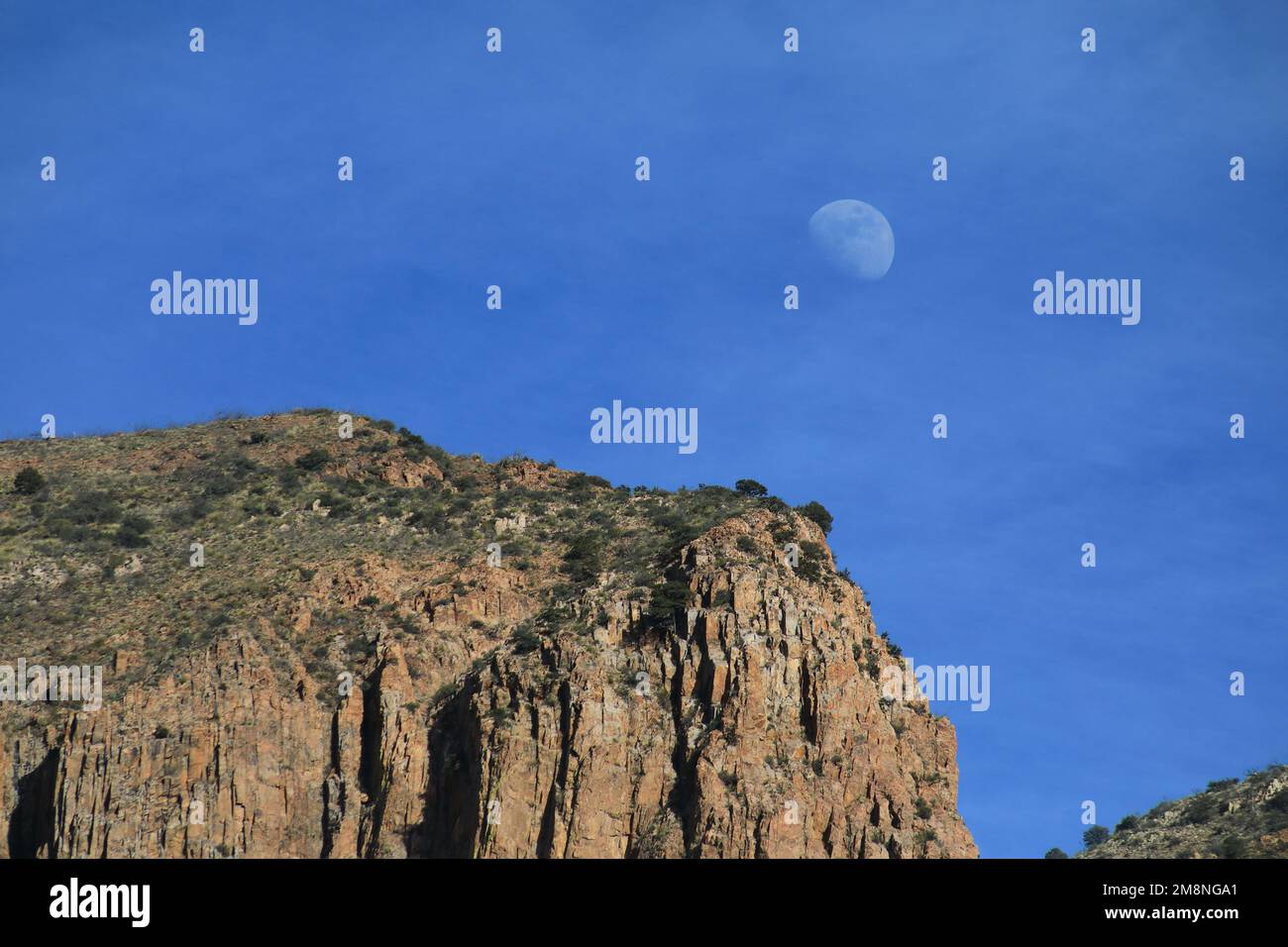 Cliffs and the moon Stock Photo - Alamy