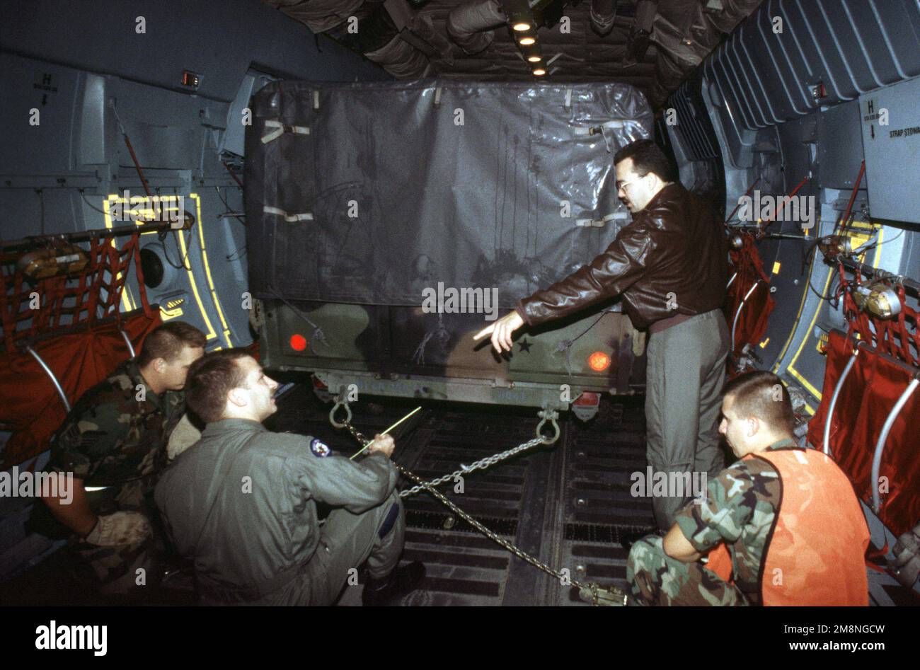 USAF Technical Sergeant Juan Claudio instructs STAFF Sergeant Joe ...