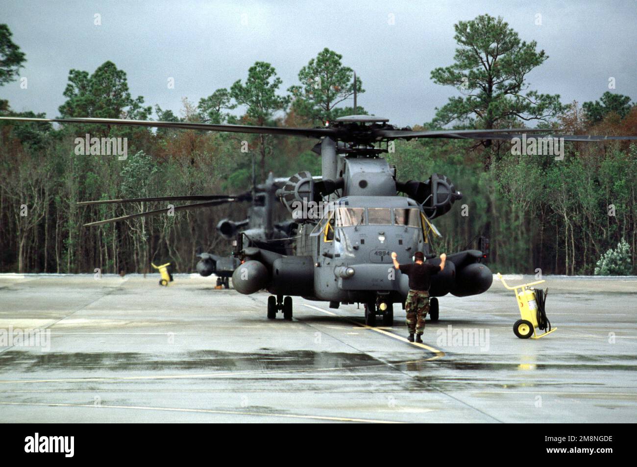 A medium shot front view of two USAF HH-53H Pave Low helicopters being ...