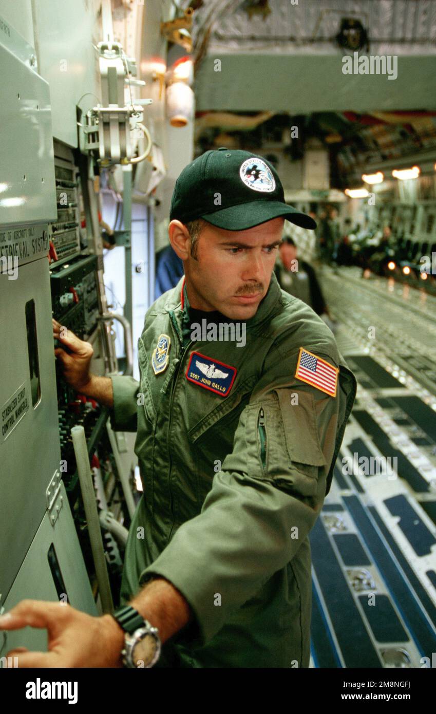 Straight on medium close-up of USAF STAFF Sergeant John Gallo, a C-17 ...