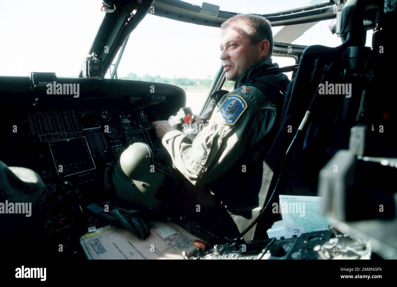 Left side rear view of USAF Major Graham Buschor in the co-pilot's seat ...