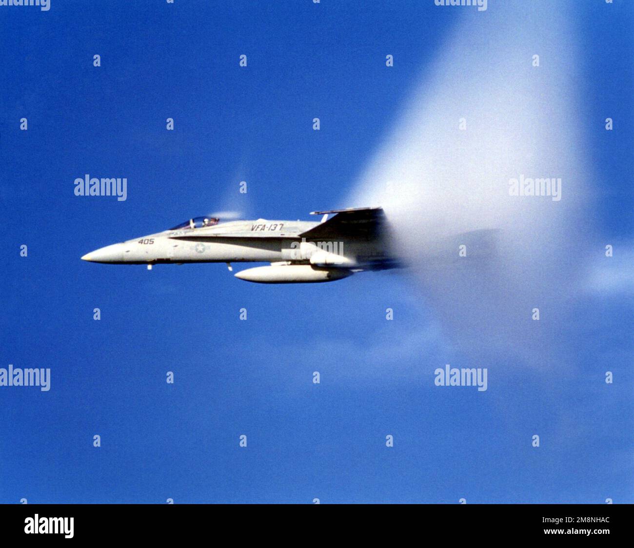 An F/A 18 Hornet from Strike Fighter Squadron 137 (VFA-137) flies ...