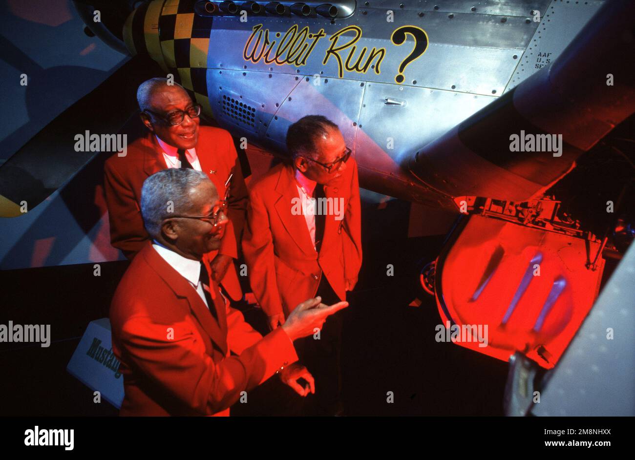 High angle shot looking down at three members of the Tuskegee Airmen as ...