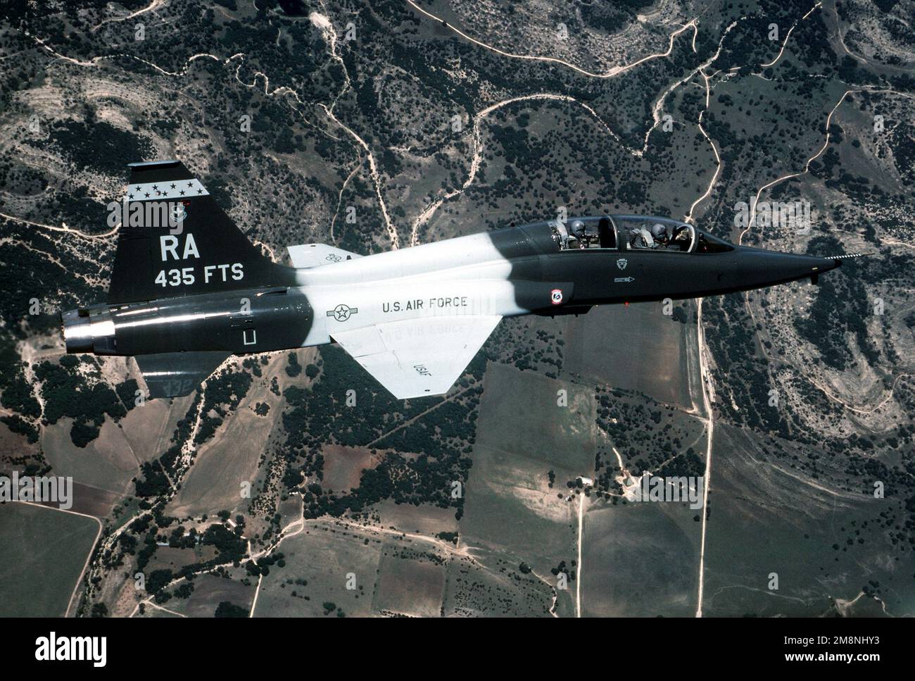 Right side profile medium aerial shot of an AT-38B Talon from the 435th ...