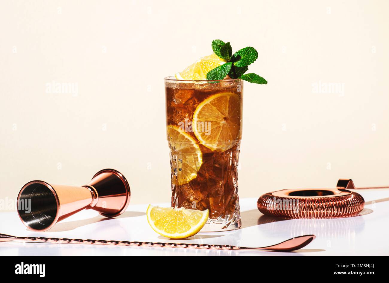 Long Island ice tea cocktail with vodka, rum, tequila, gin, liquor, lemon juice, cola and ice ...