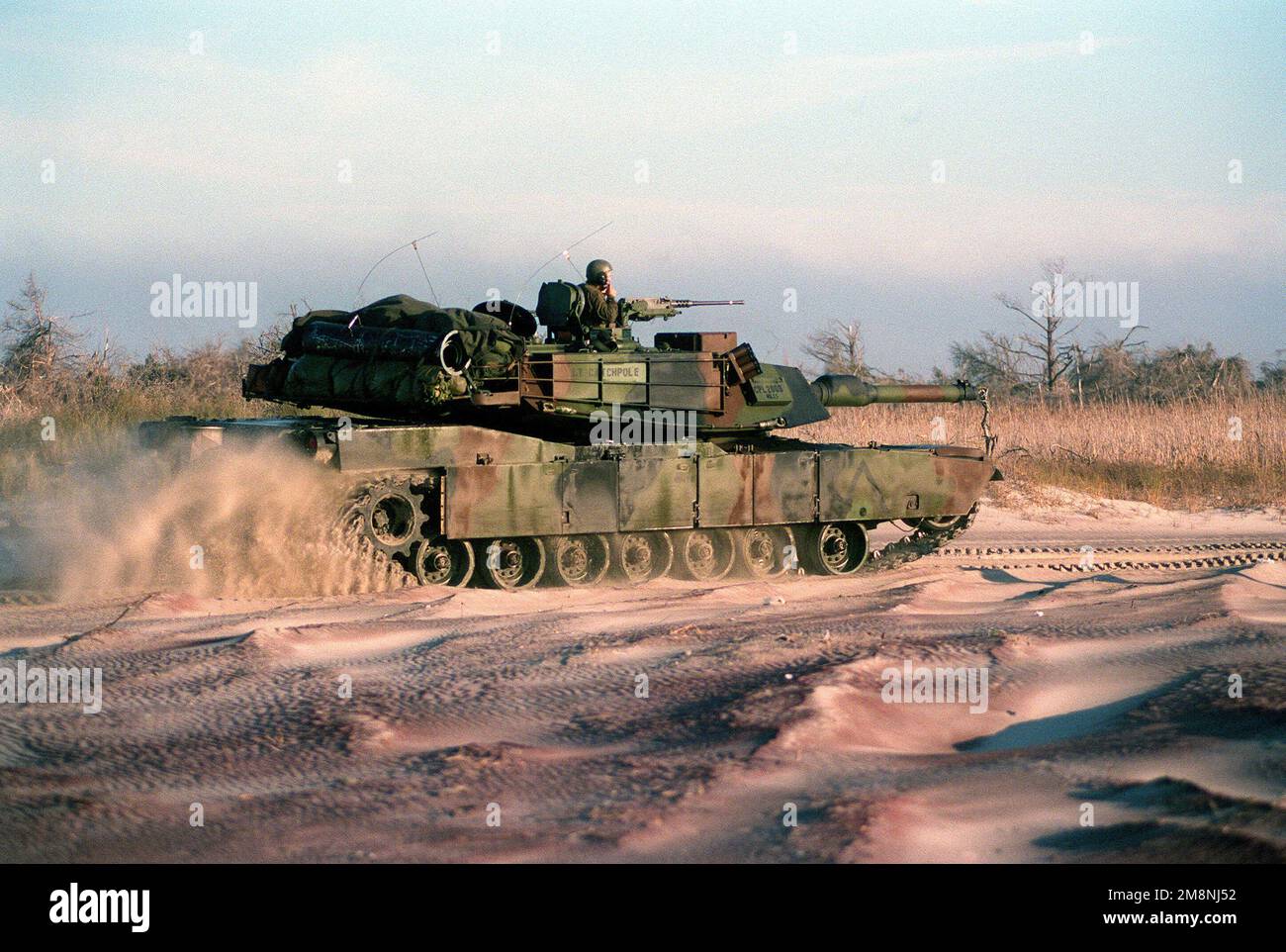 An M1A1 Abrams Main Battle Tank advances along Onslow Beach during Type ...