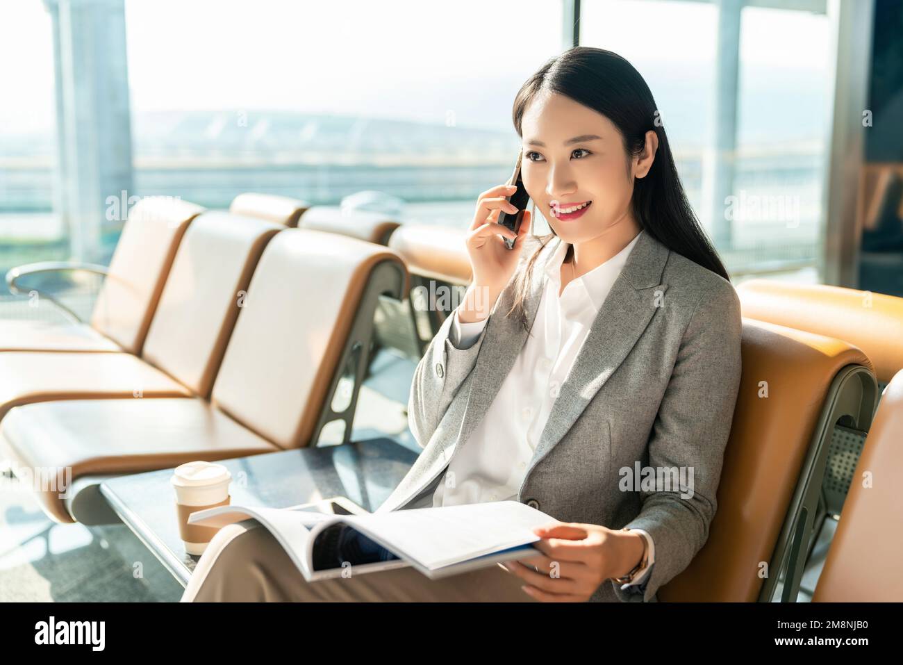 Ms business call waiting at the airport Stock Photo - Alamy