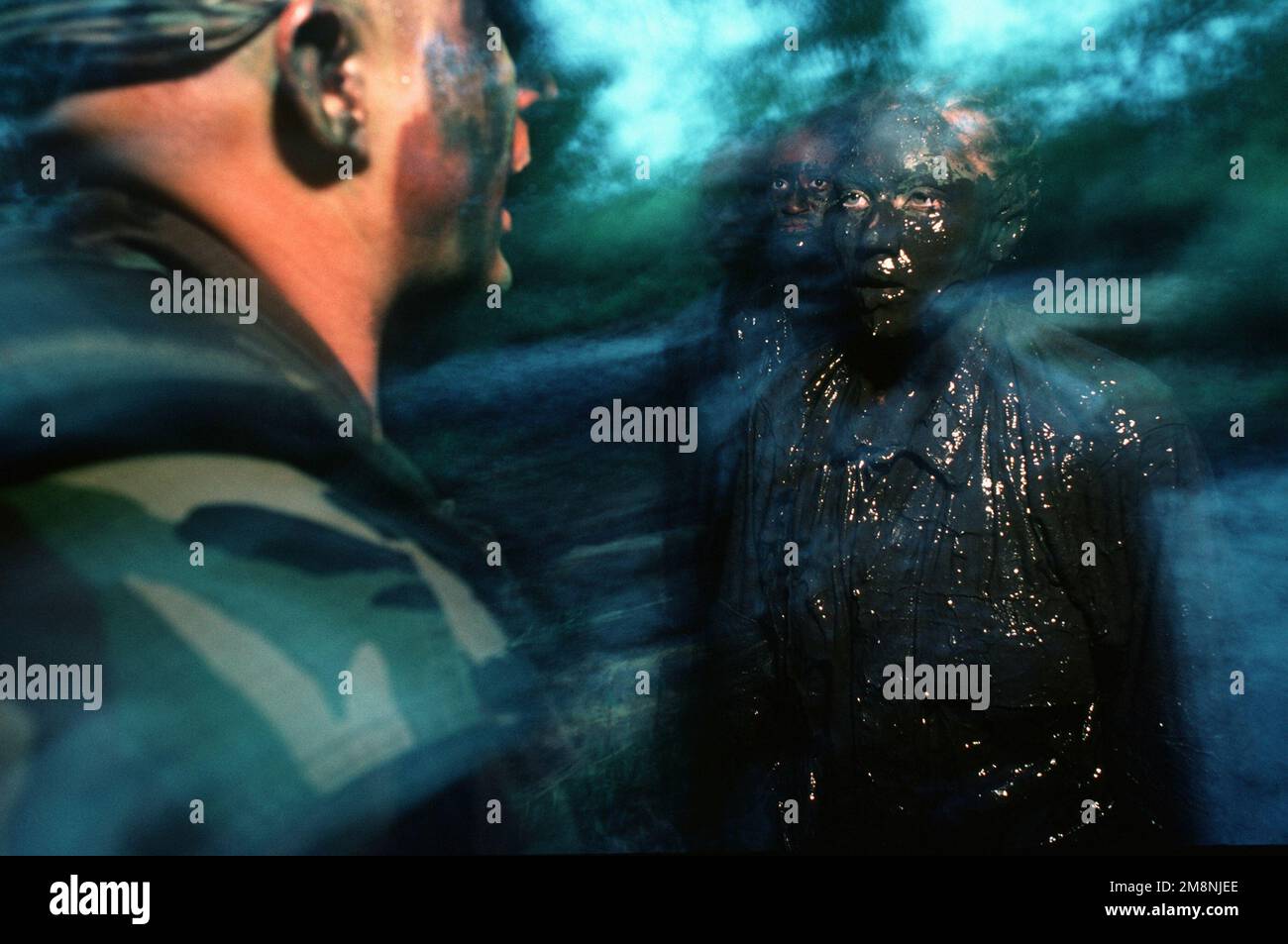 US Air Force Technical Sergeant Ron "Hammer" Hetzel dresses down a mud ...