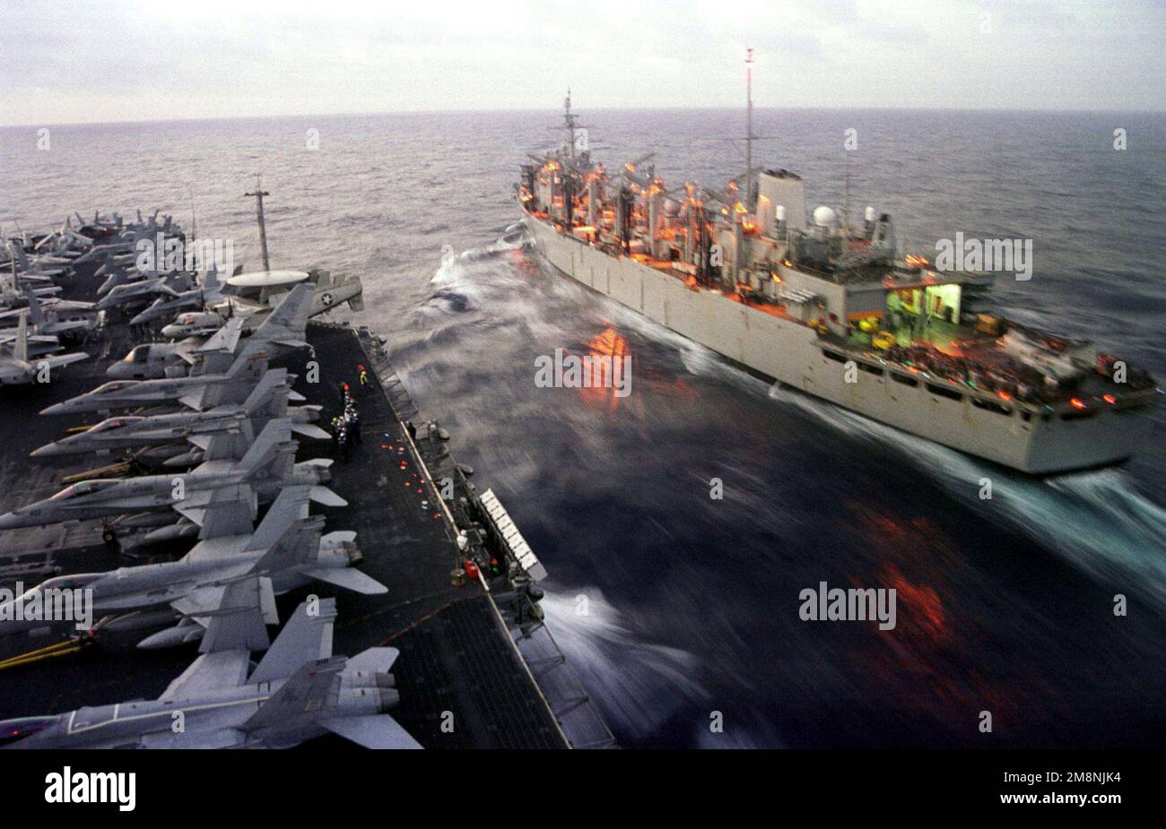 As the sun begins to rise USS ENTERPRISE (CVN 65) makes her approach on ...