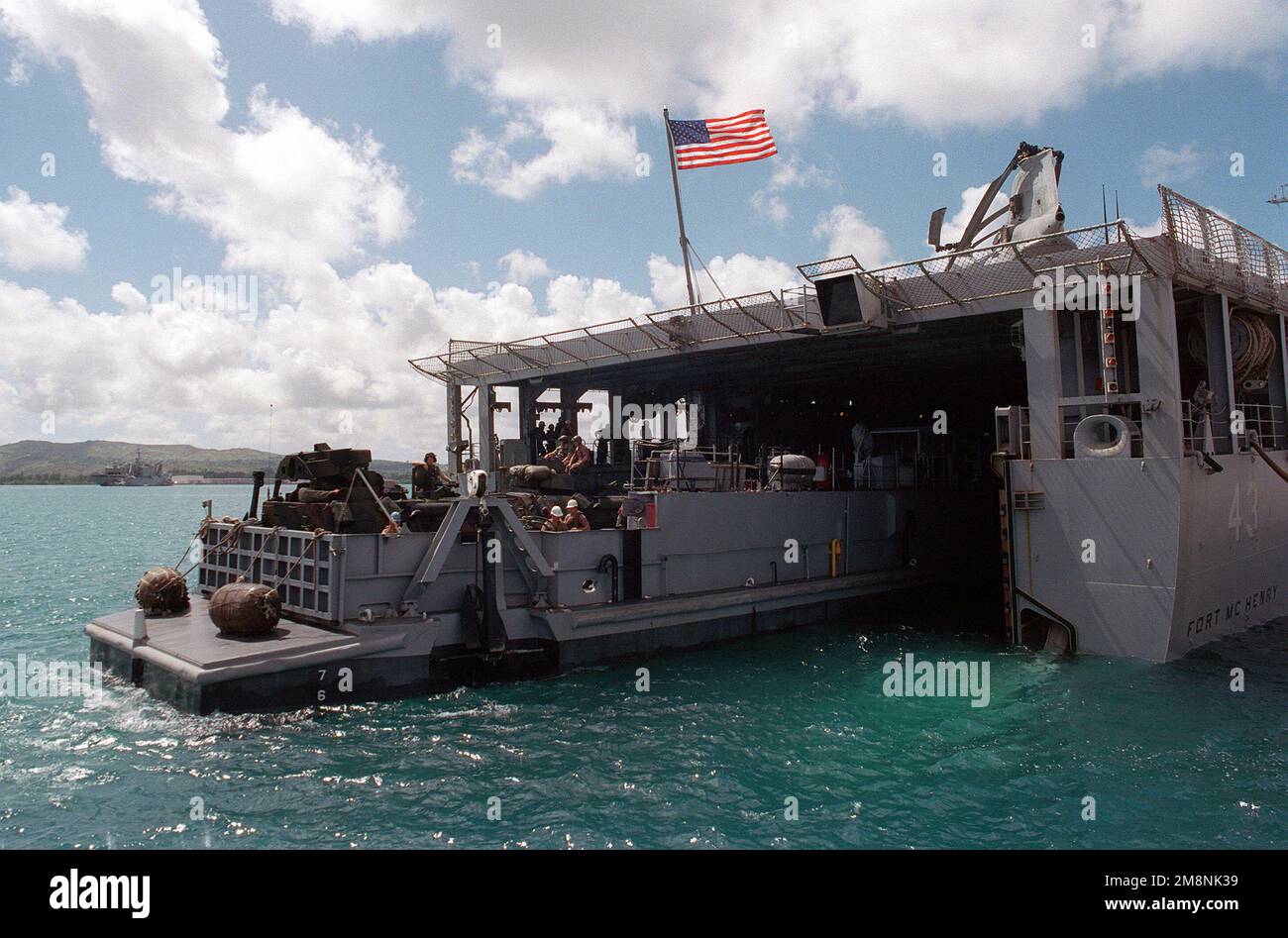 An US Navy (USN) Utility Landing Craft (LCU 1630) exits the well deck ...