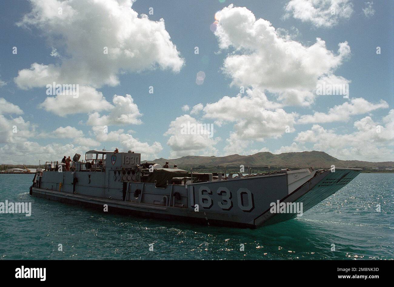 The US Navy (USN) Utility Landing Craft (LCU 1630) prepares to ferry a ...