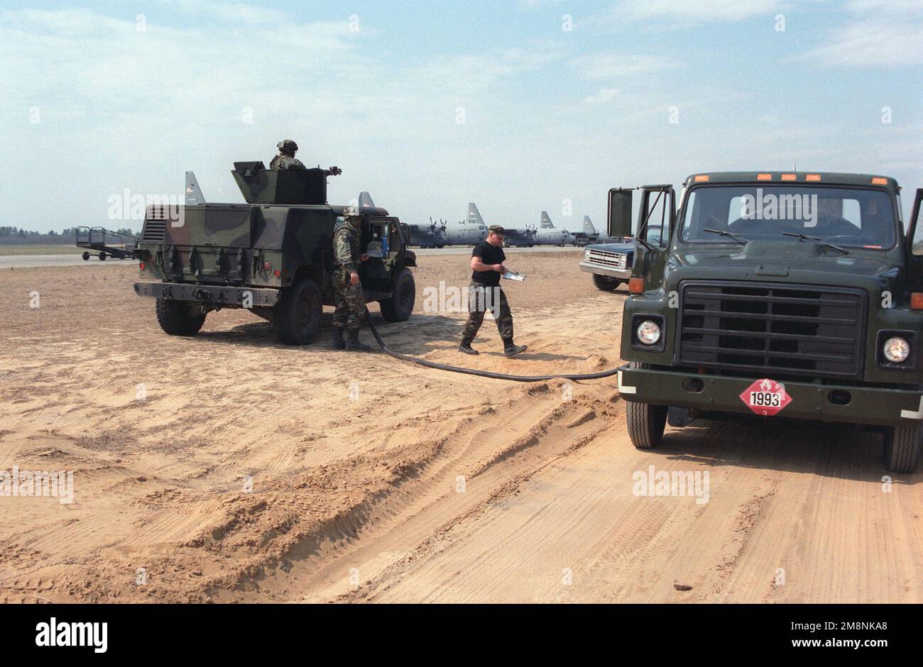 US Air Force AIRMAN First Class (A1C) Robert Weaver (center) walks to ...