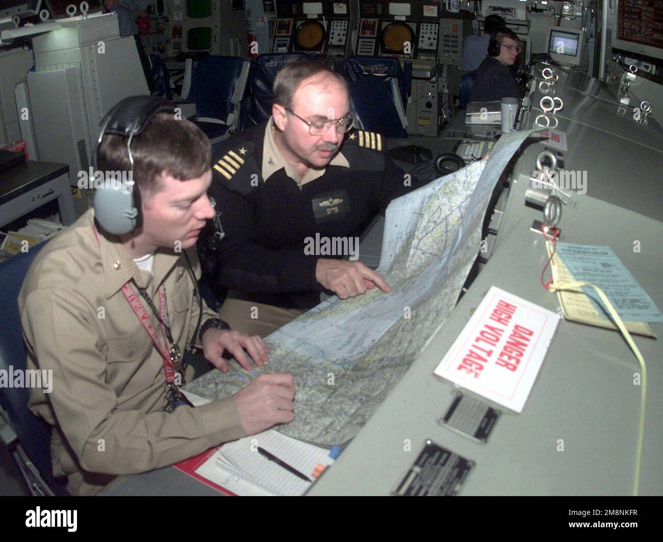 U.S. Navy CAPT Robert D. Jenkins III (right), Commanding Officer of the ...