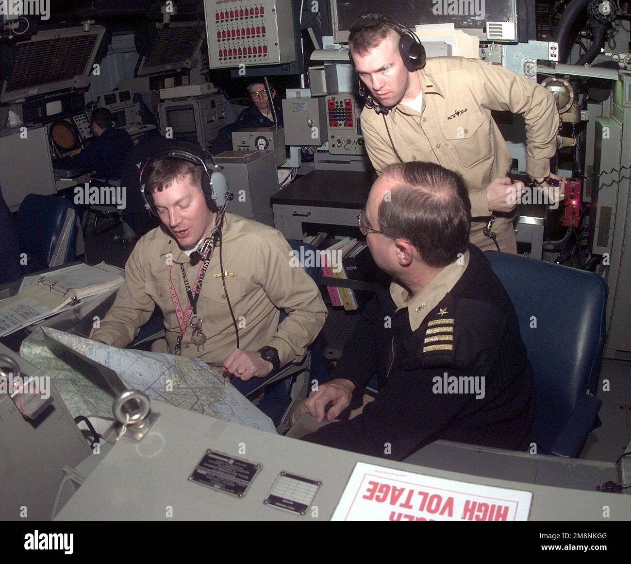 U.S. Navy CAPT Robert D. Jenkins III (right), Commanding Officer of the ...