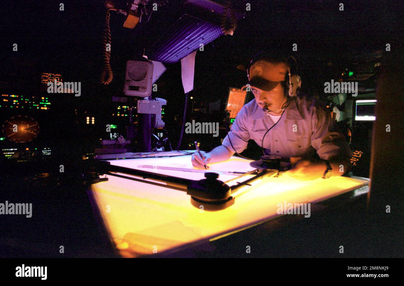 Working in the Combat Information Center (CIC) on board USS VANDERGRIFT ...