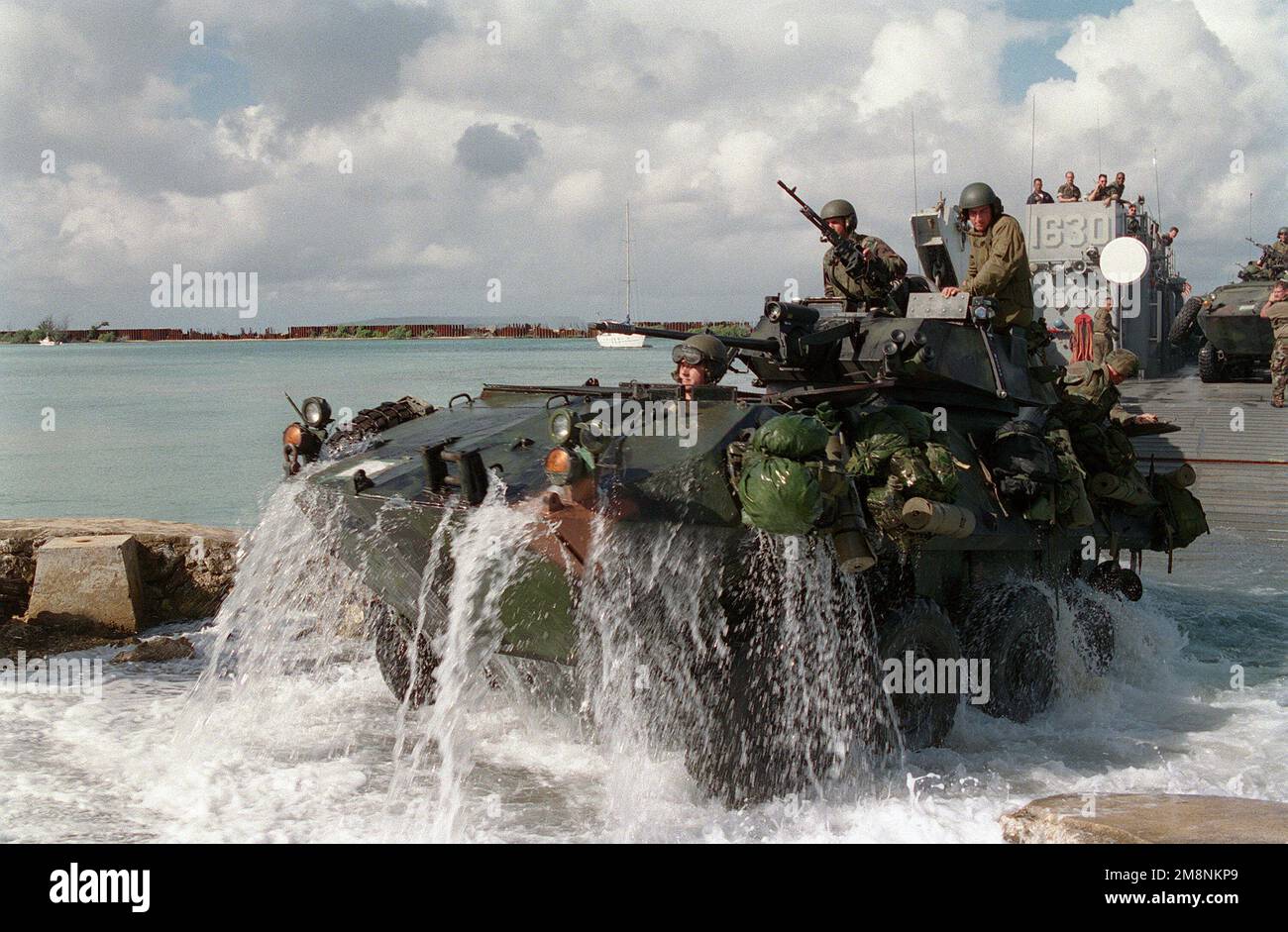 A US Marine Corps LAV-25 (Light Armored Vehicle) comes ashore on Tinian ...