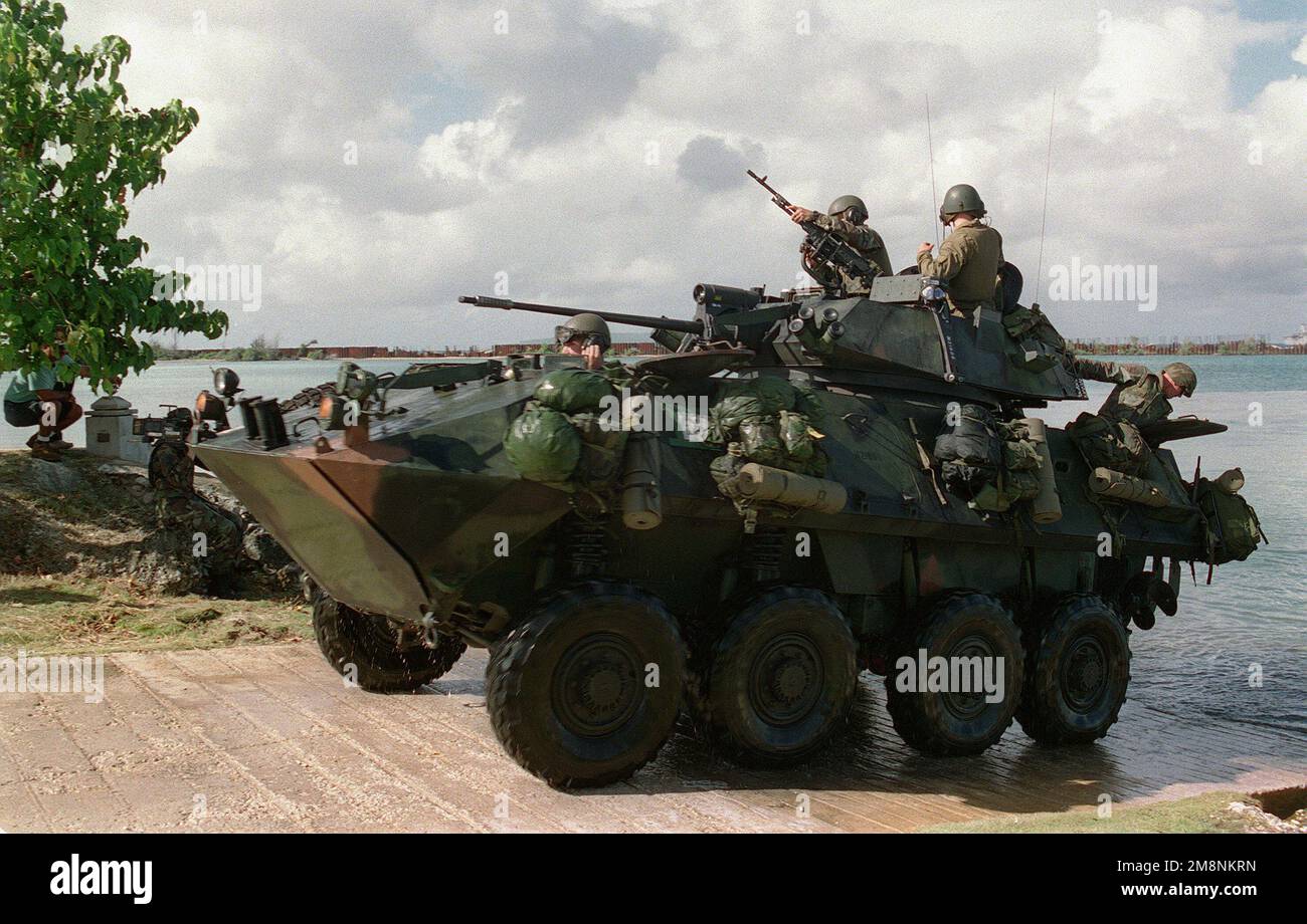 A US Marine Corps LAV-25 (Light Armored Vehicle) comes ashore on Tinian ...