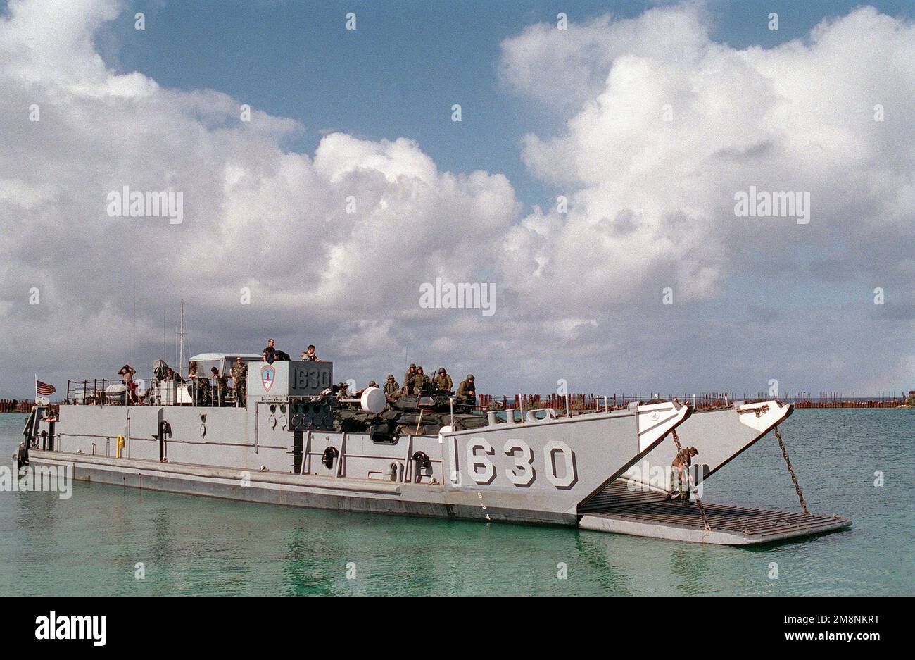 The US Navy (USN) Utility Landing Craft (LCU 1630) prepares to offload ...