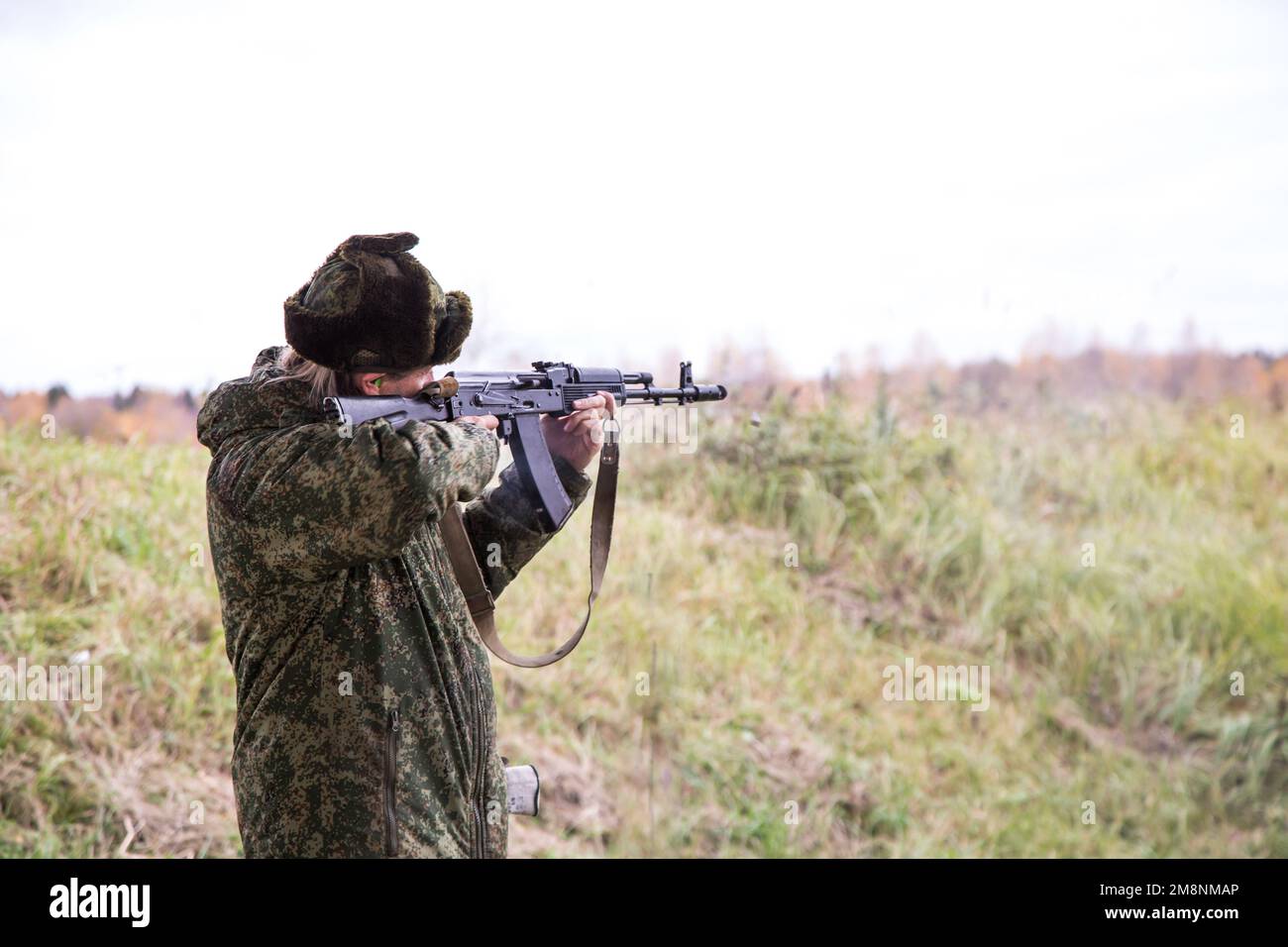 Man shooting at a target. Unformal shooting range Stock Photo - Alamy