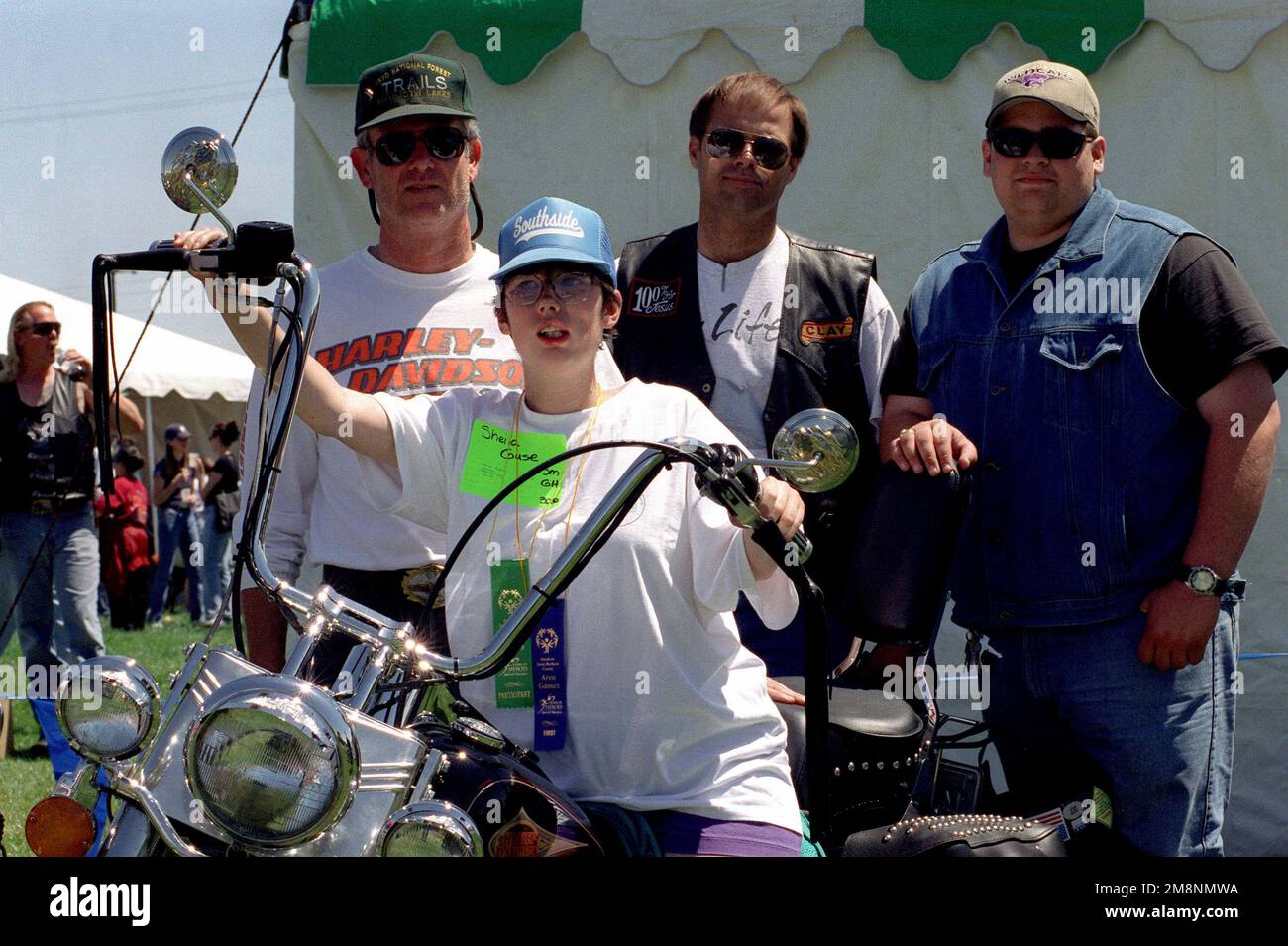 Sheila Guse sits on a Harley Davidson, put on display by the Santa ...