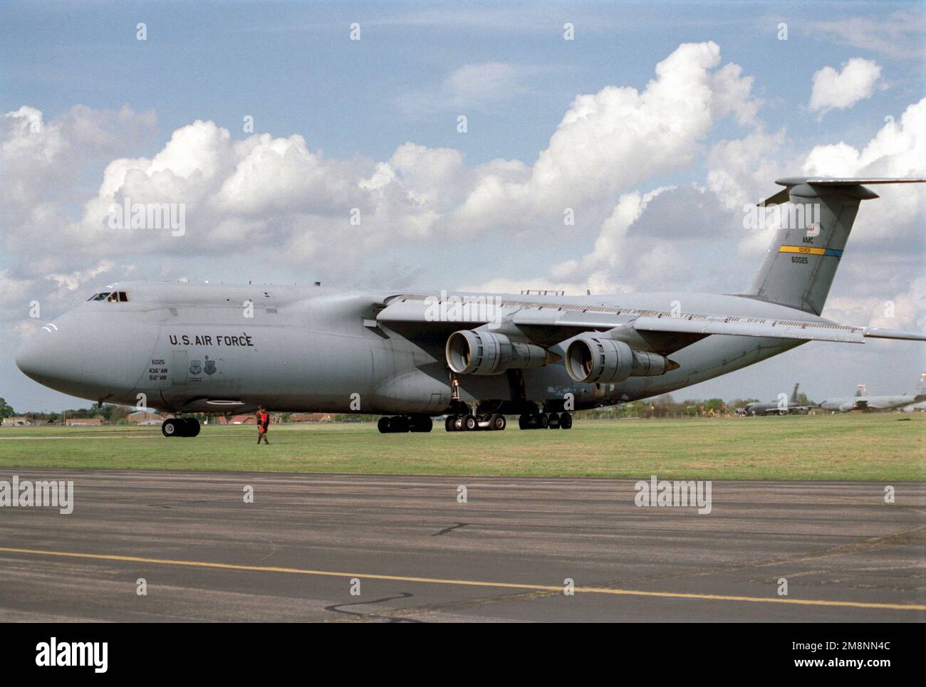 A wide view as a marshaler with the 627th Air Mobility Support Squadron ...