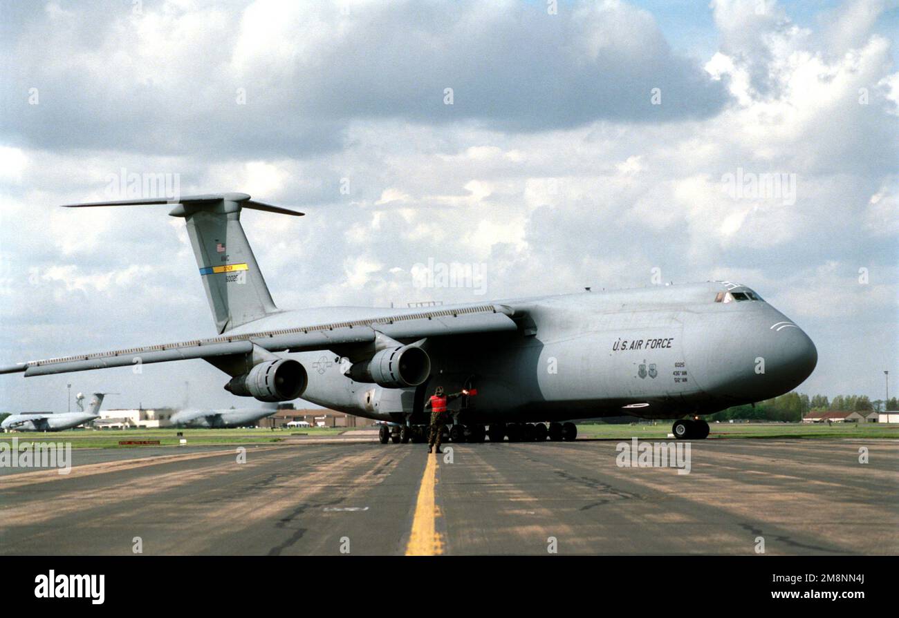 A marshaler with the 627th Air Mobility Support Squadron, RAF ...