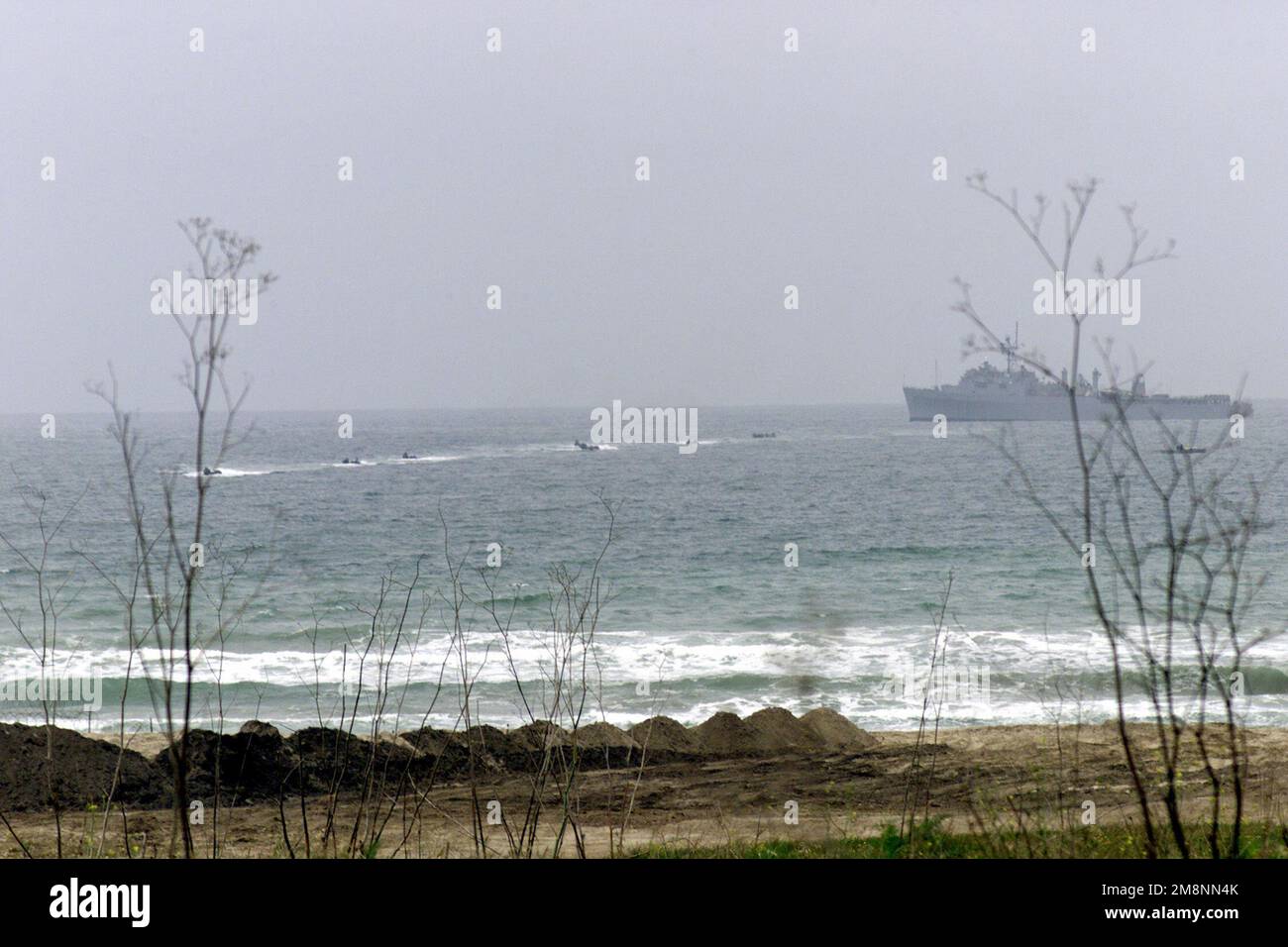 Formation of US Marine Amphibious Assault Vehicles (AAV), swim off the ...