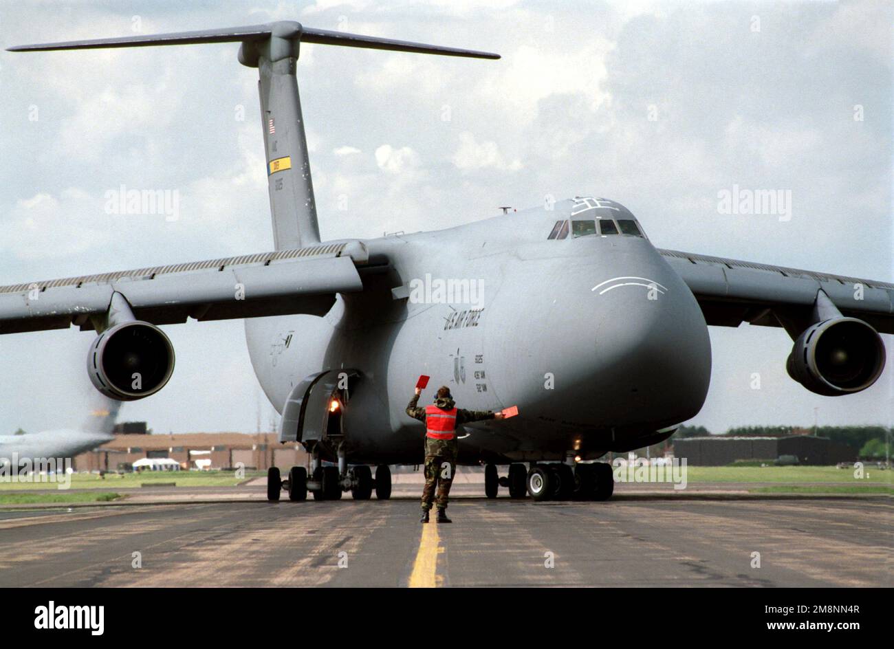 A marshaler with the 627th Air Mobility Support Squadron, RAF ...