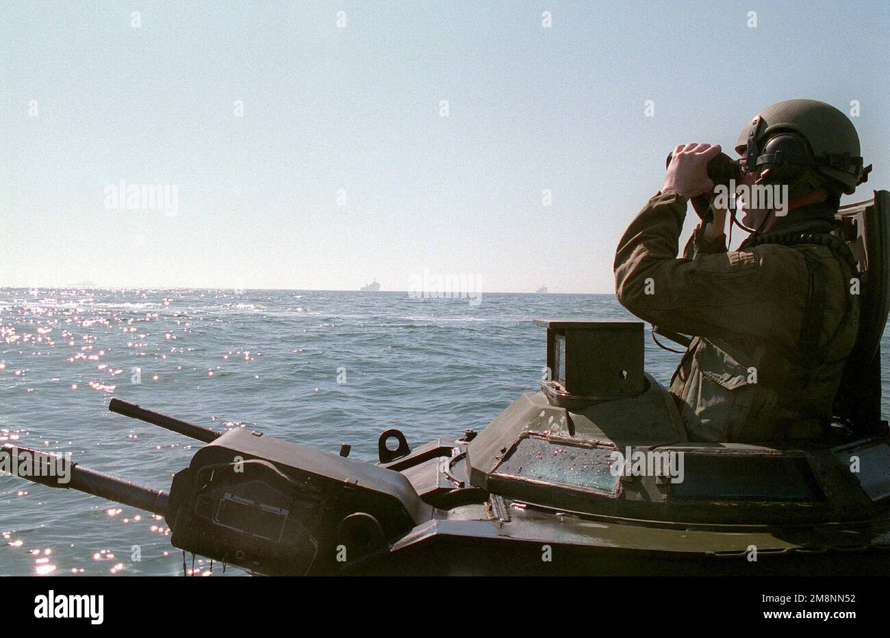 Medium close-up, left side profile of a Marine standing out of the ...