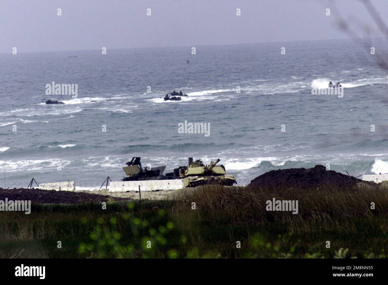 An AAV7A1, with a mine clearance system kit, prepares rocket launcher ...