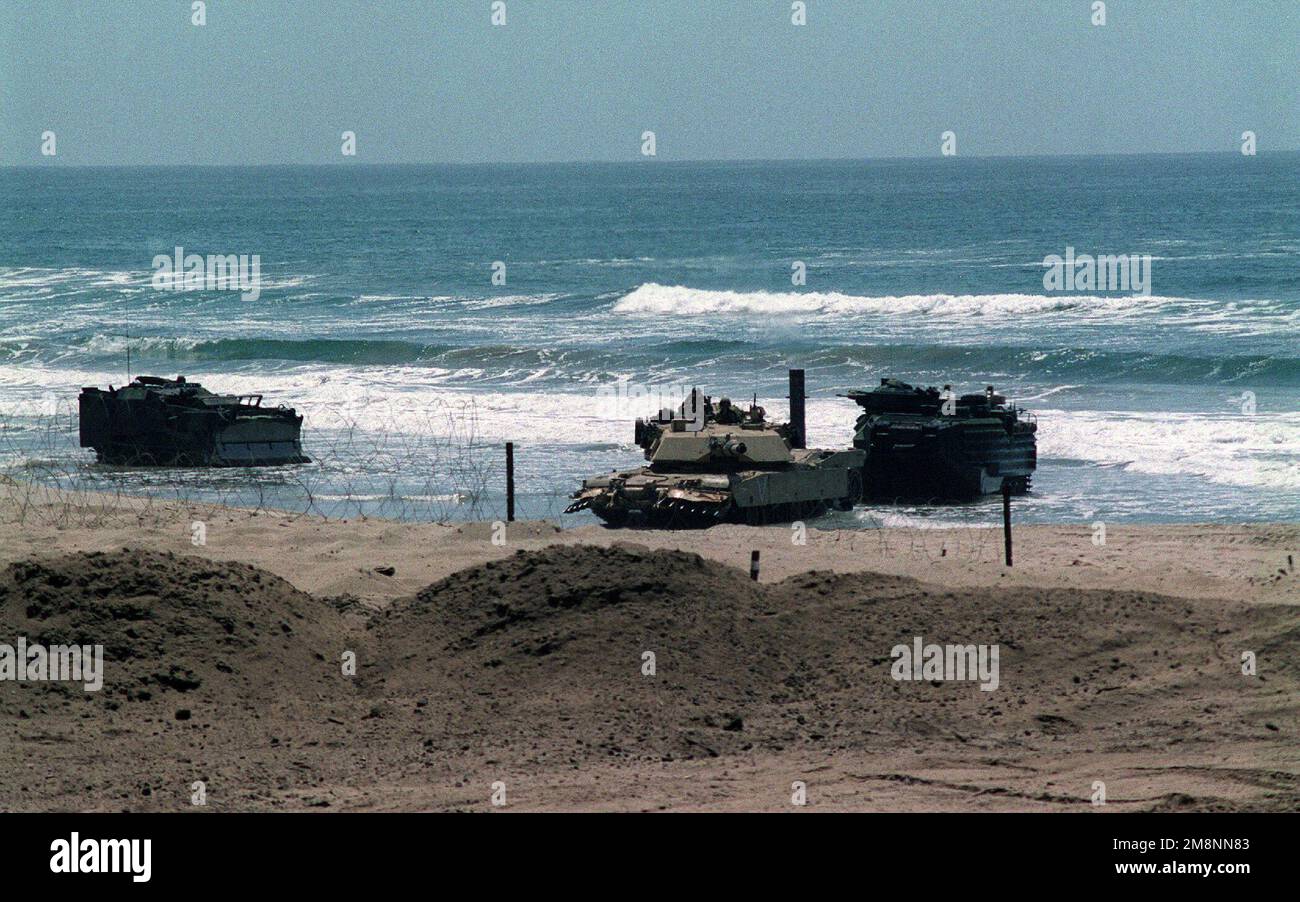 990424-M-2126S-002. [Complete] Scene Caption: Tank Company emerges from ...