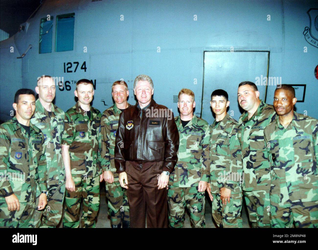 President William Jefferson Clinton poses for a picture, next to a US ...