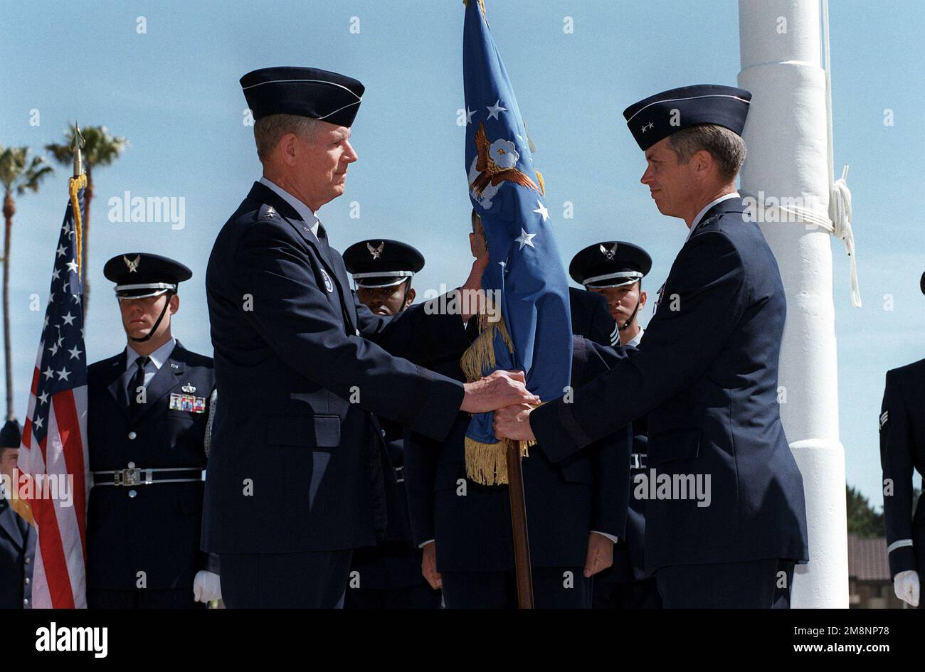 US Air Force Major General Gerald Perryman Jr., (Right) passes the flag ...