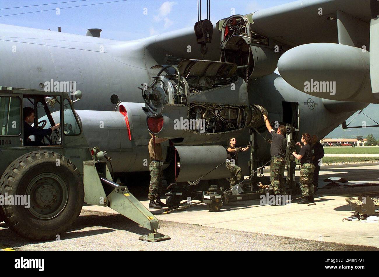 Airmen from Davis Monthan AFB, Arizona 43rd ECS, prepare to pull an engine from a C-130 in ...