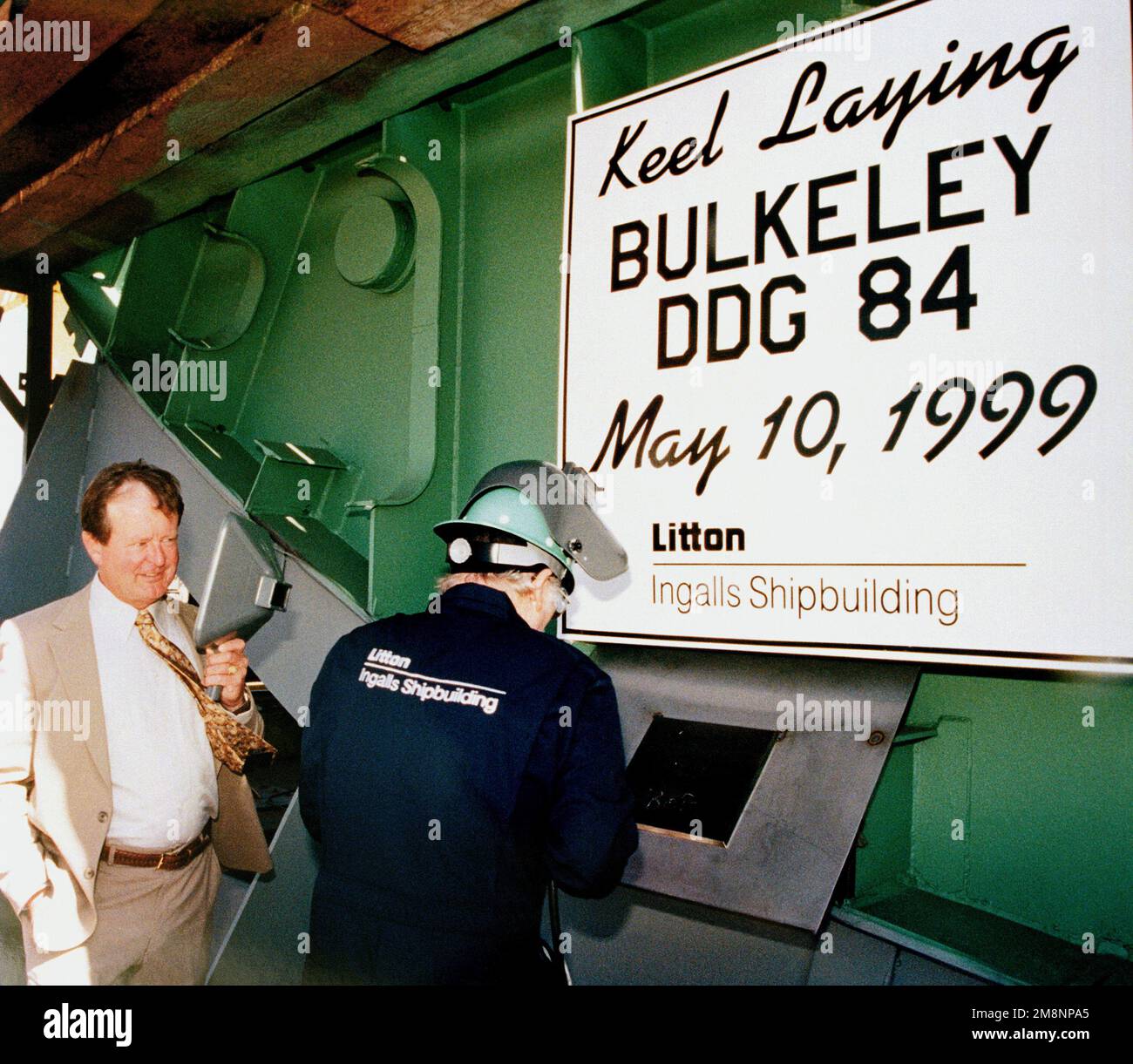 KEEL LAYING. Captain Peter Bulkeley, USN (Ret), looks on as Mr. Charlie ...