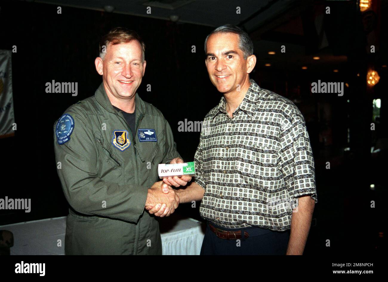 Air Force Association President John McKee presents a momento to ...