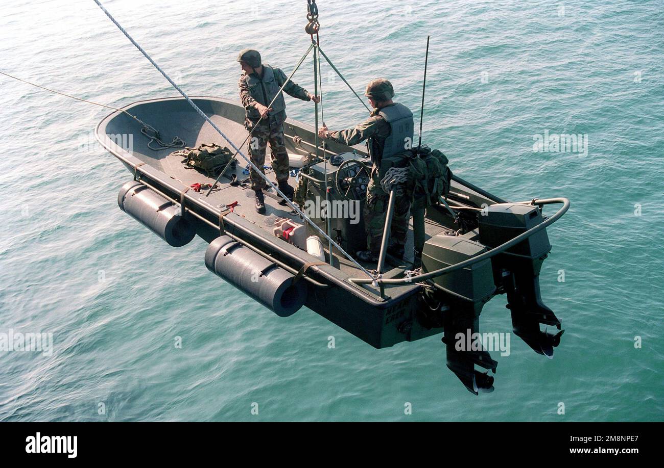 US Marine Corps Corporal Jason J. Pingel, 'A'-Coxwain (left) and USMC ...