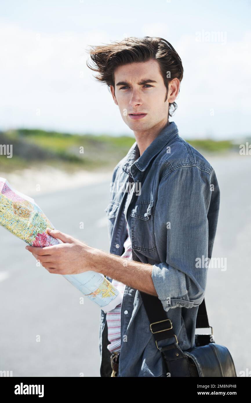 I might be lost...Lost young man standing on the side of the road ...