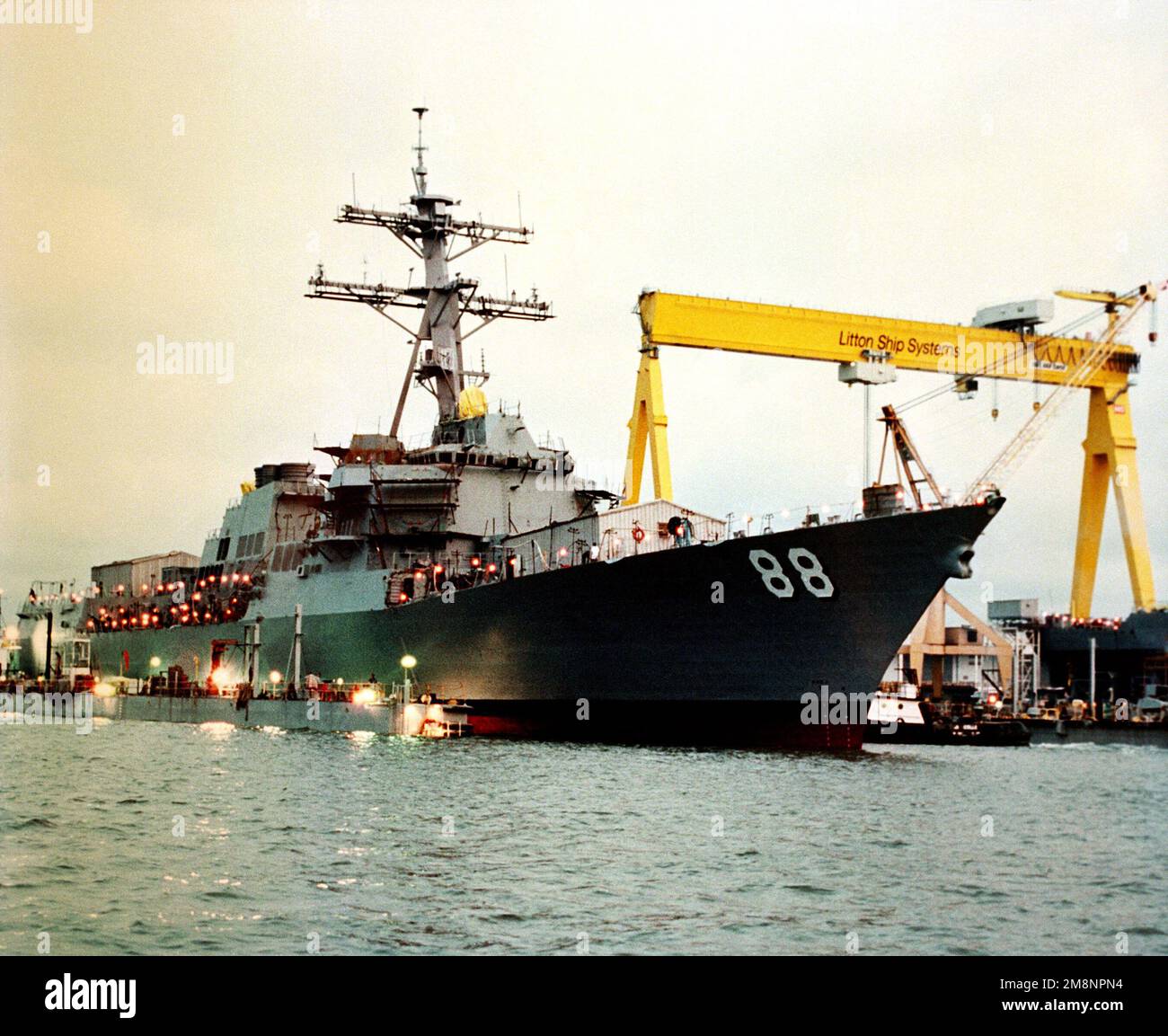 At days end, the Arleigh Burke Aegis class guided missile destroyer USS ...