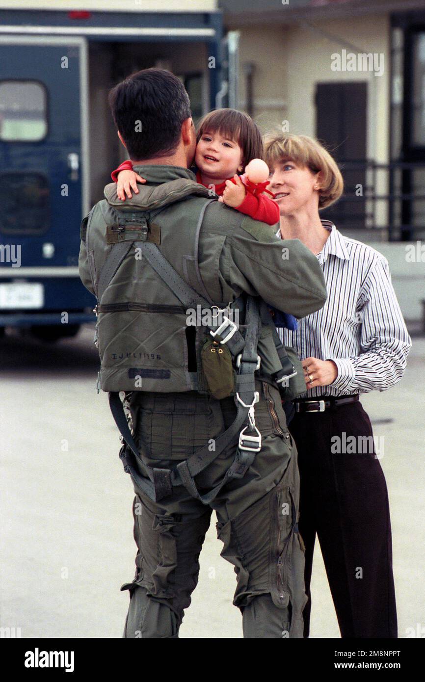 Major Robert Dooley is greeted by his wife, Jennifer, daughter, Lauren ...