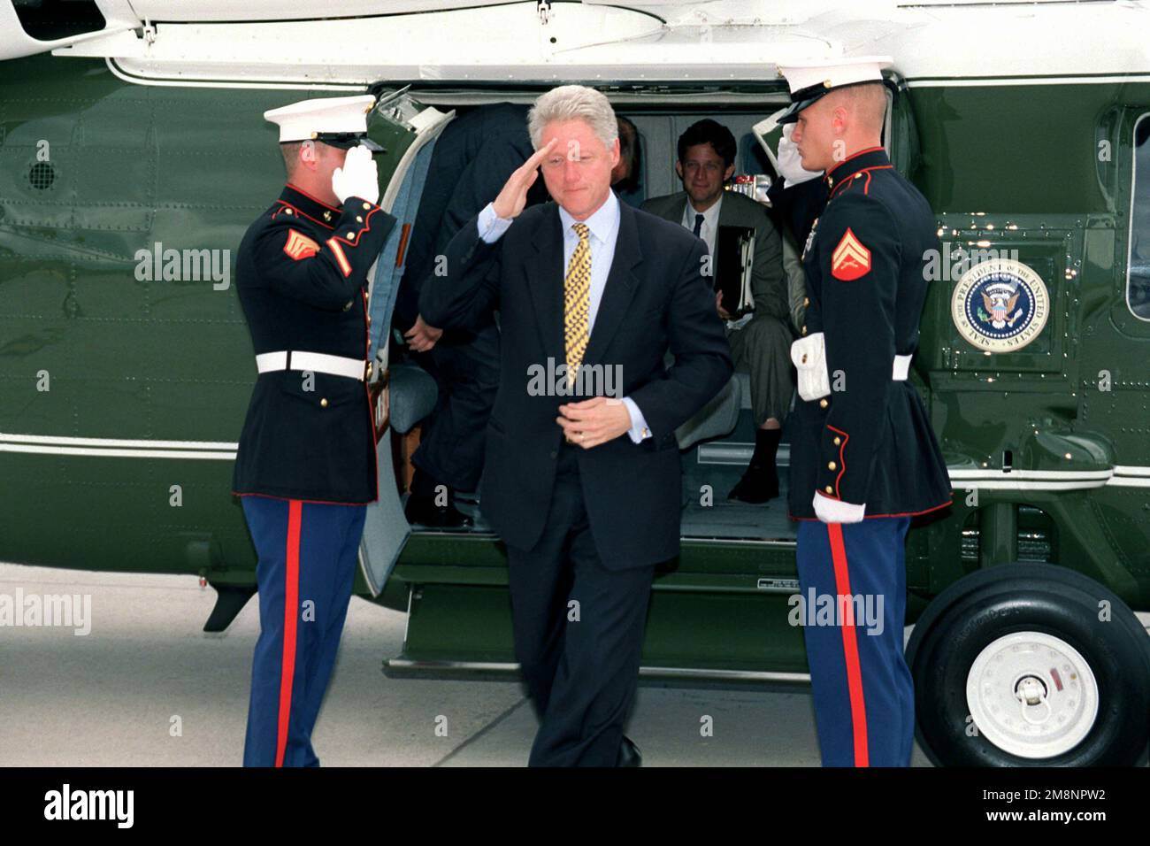 President William Jefferson Clinton salutes as he exits Marine One, a ...
