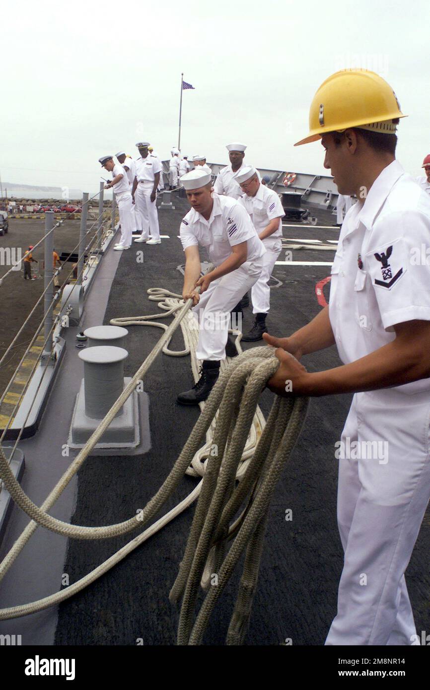 US Navy Boatswain's Mate 3rd Class Adrian Robles directs his crew of ...