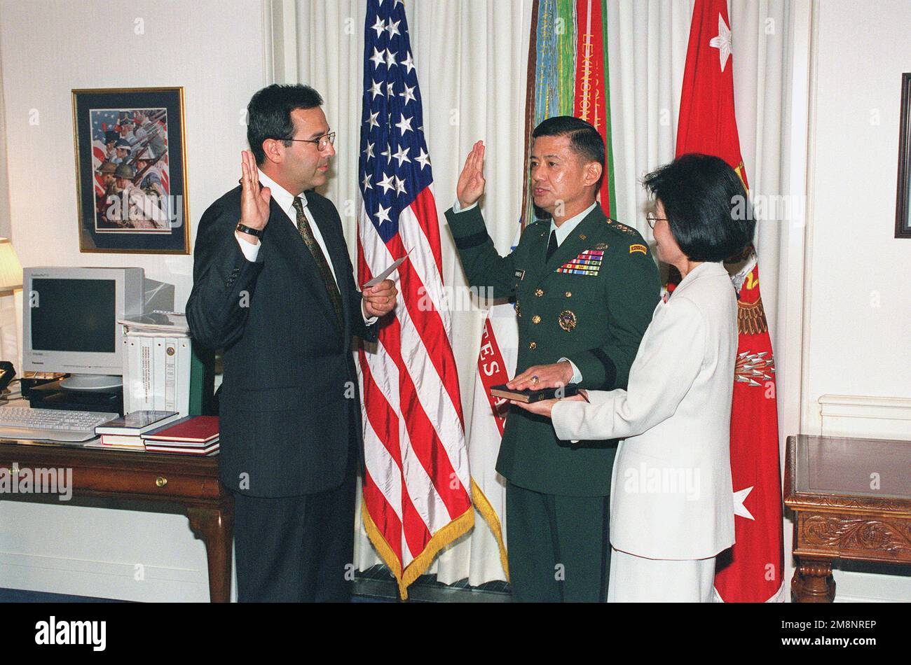 Honorable Louis Caldera, Secretary of the US Army, administers the oath ...