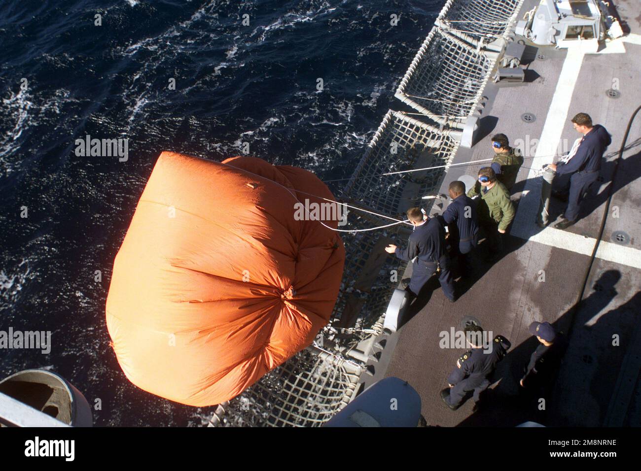 Sailors aboard USS REUBEN JAMES (FFG 57) deploy an inflatable target ...